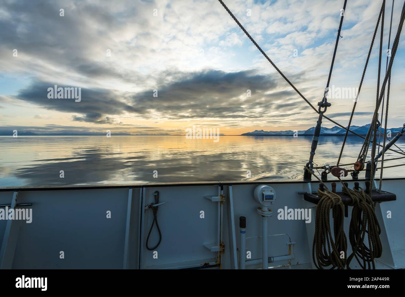 cloudy sunset sky with part of ship rail Stock Photo - Alamy