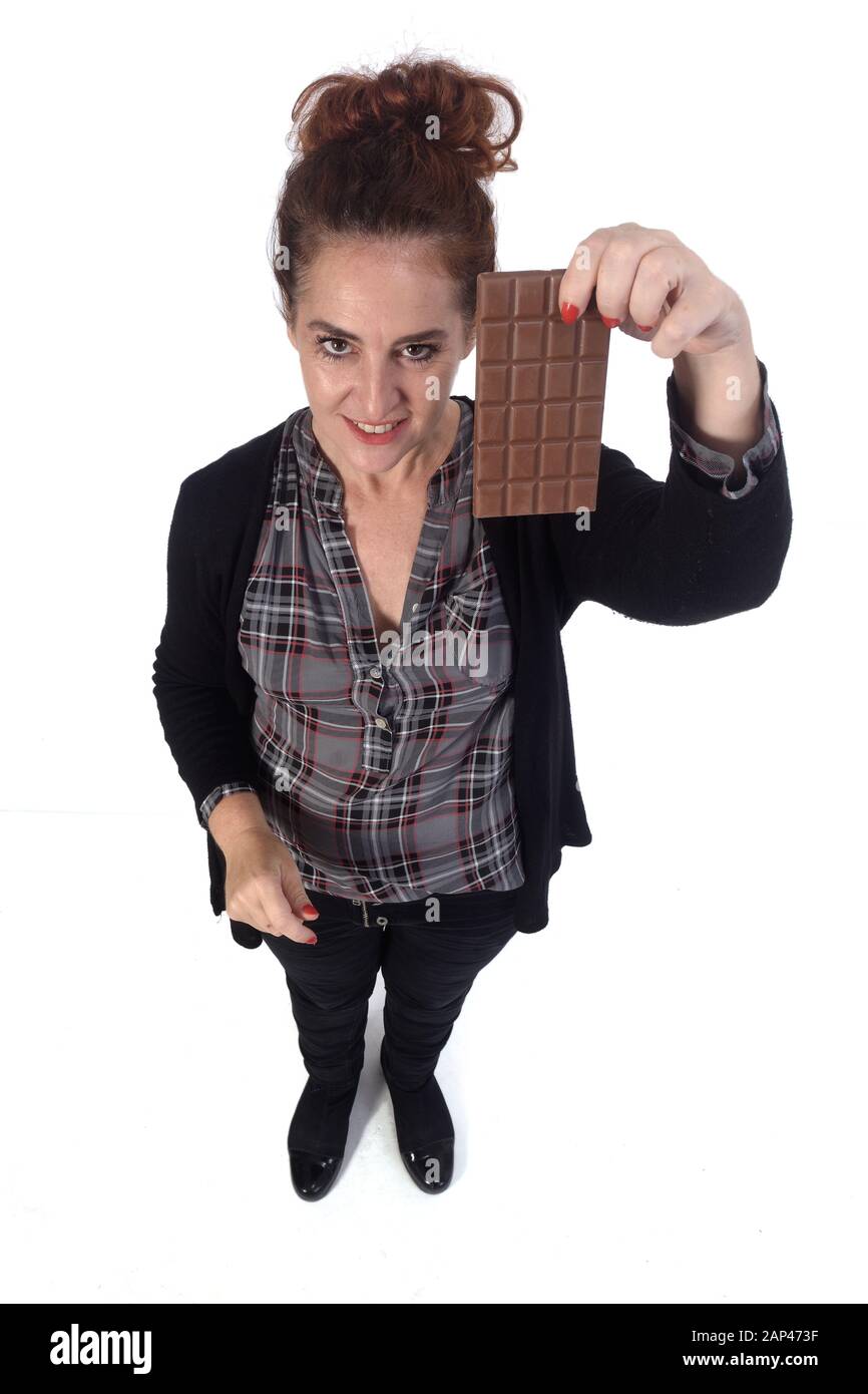 woman with chocolate bar on white background Stock Photo - Alamy