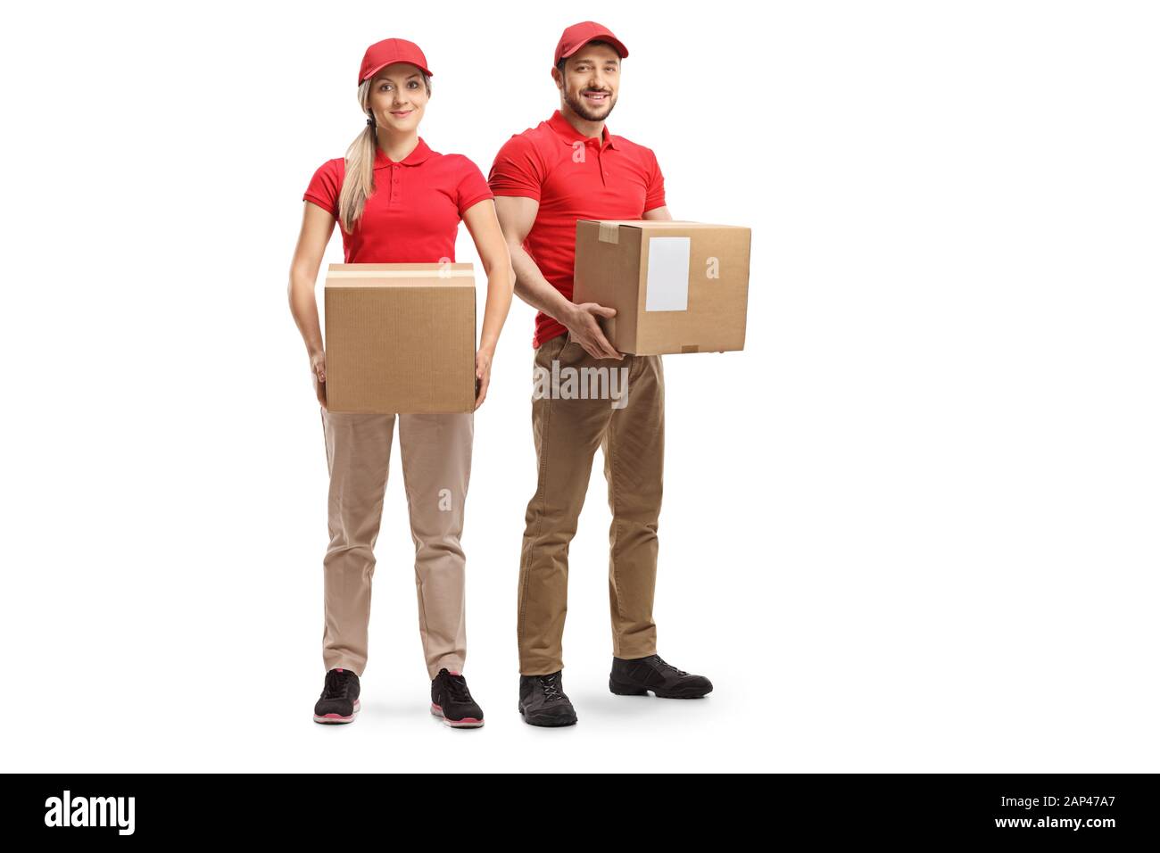 Full length portrait of a delivery team of a man and woman holding ...