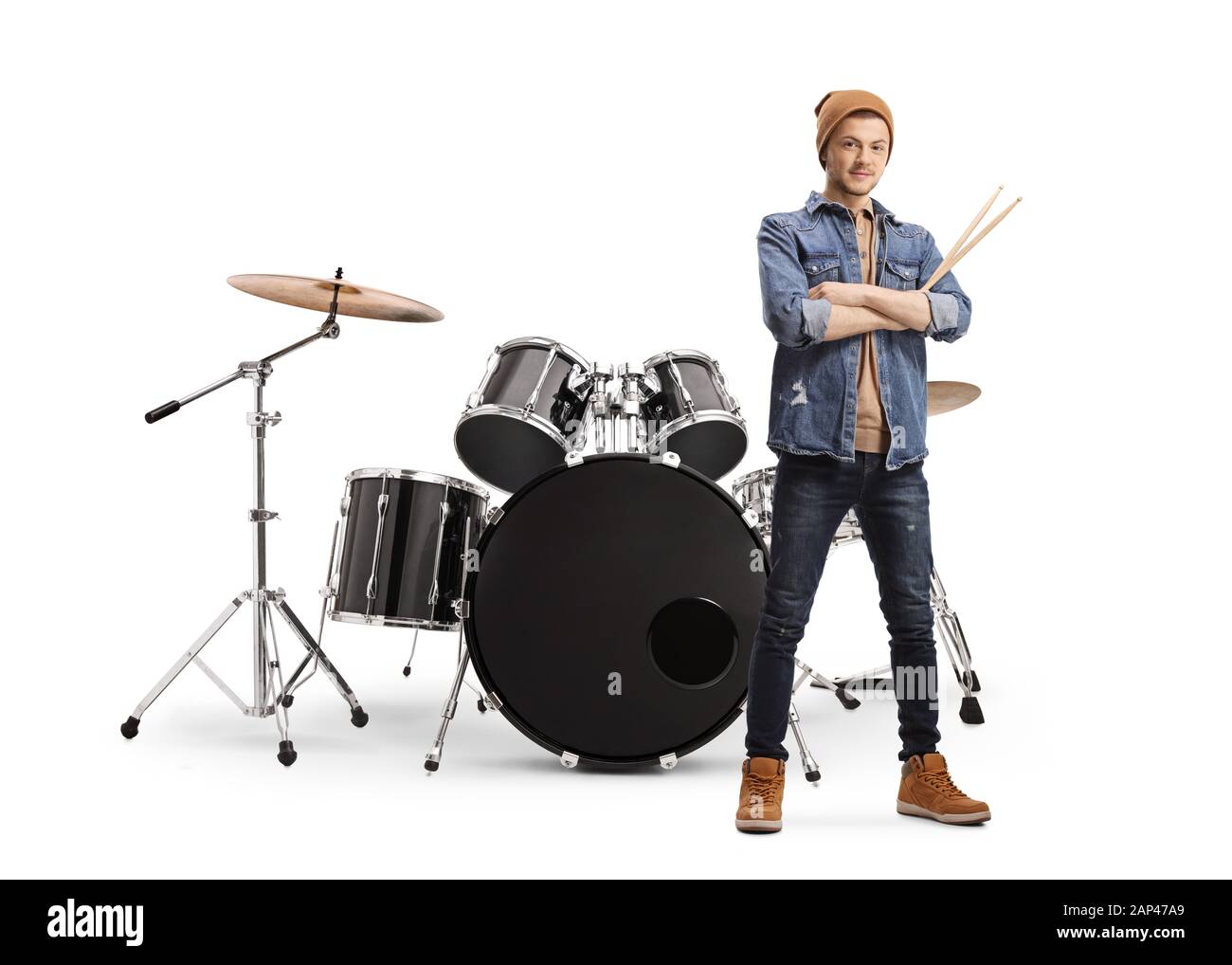 Full length portrait of a guy in casual clothes holding drumsticks and ...
