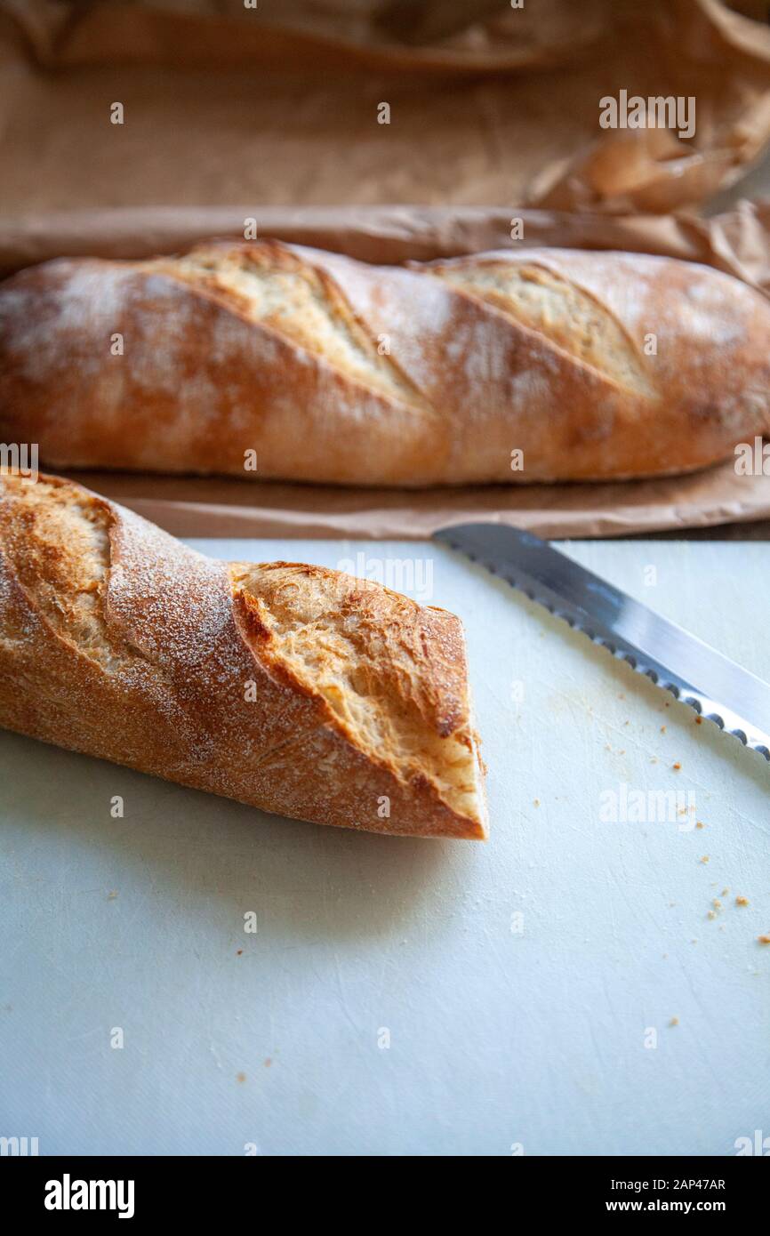 Baguette Bread on Breadboard Stock Photo - Alamy