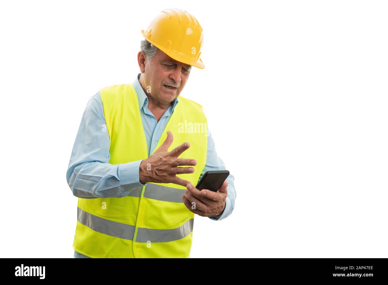 Old builder man looking at smartphone with angry expression as video ...