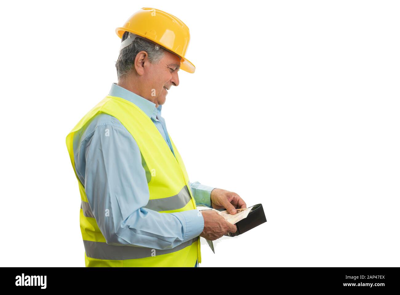 Cheerful male construction worker counting money in wallet as payment ...