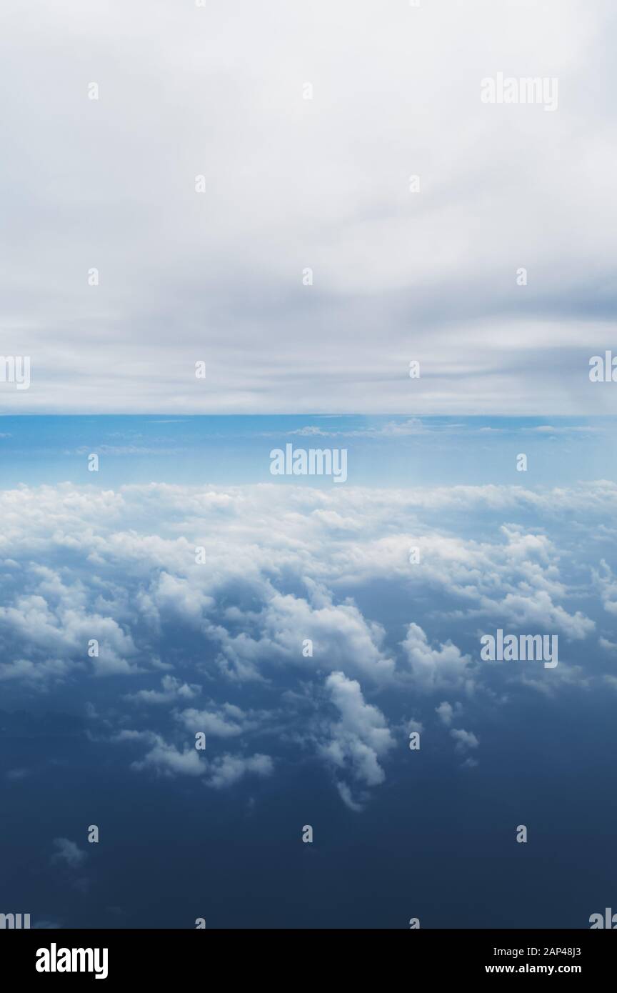 Aerial view of clouds and horizon from airplane window Stock Photo - Alamy