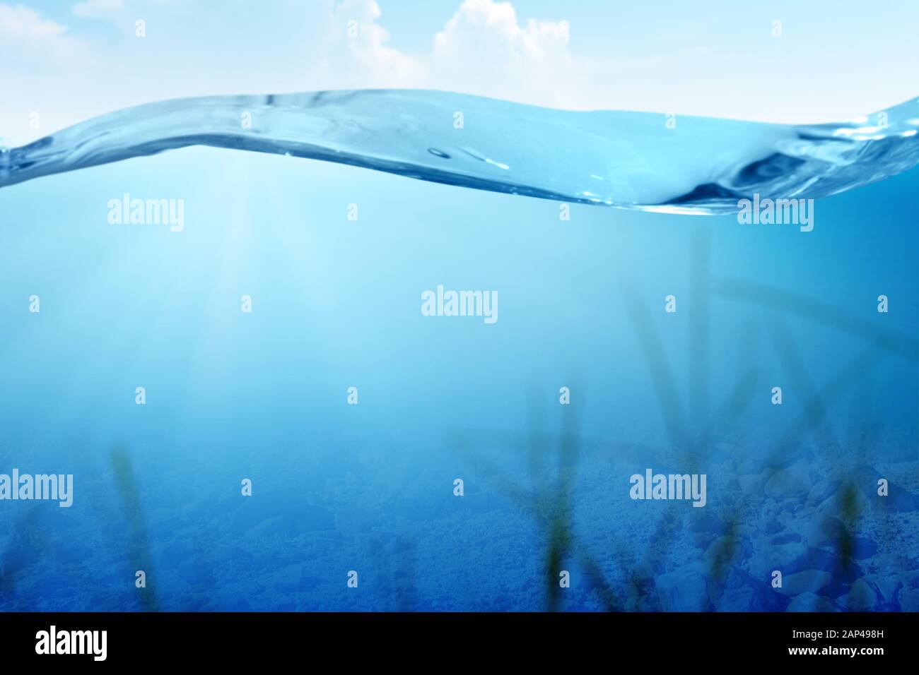 A wave of blue water on the ocean with a blue sky background Stock ...