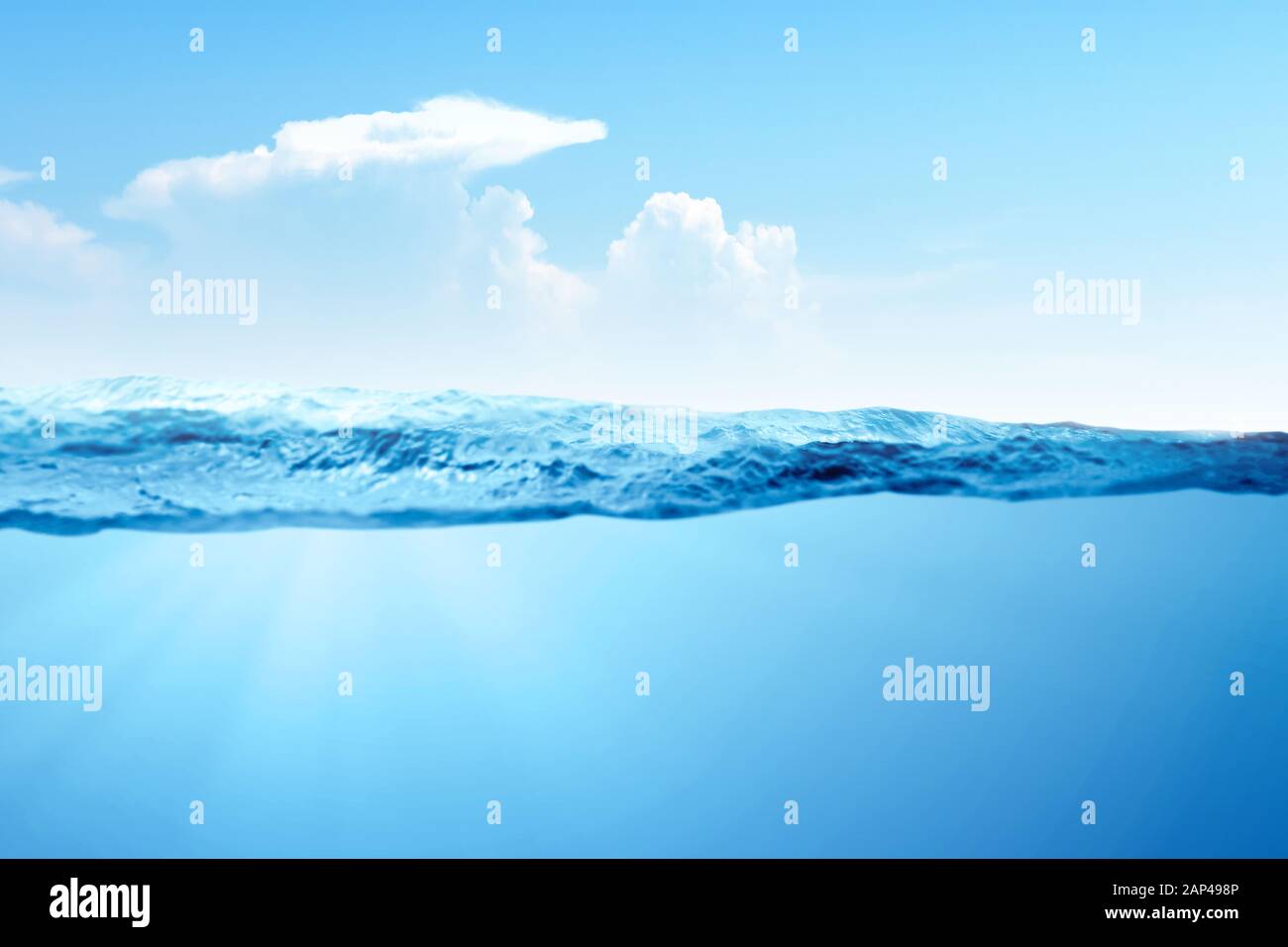 A wave of blue water on the ocean with a blue sky background Stock ...