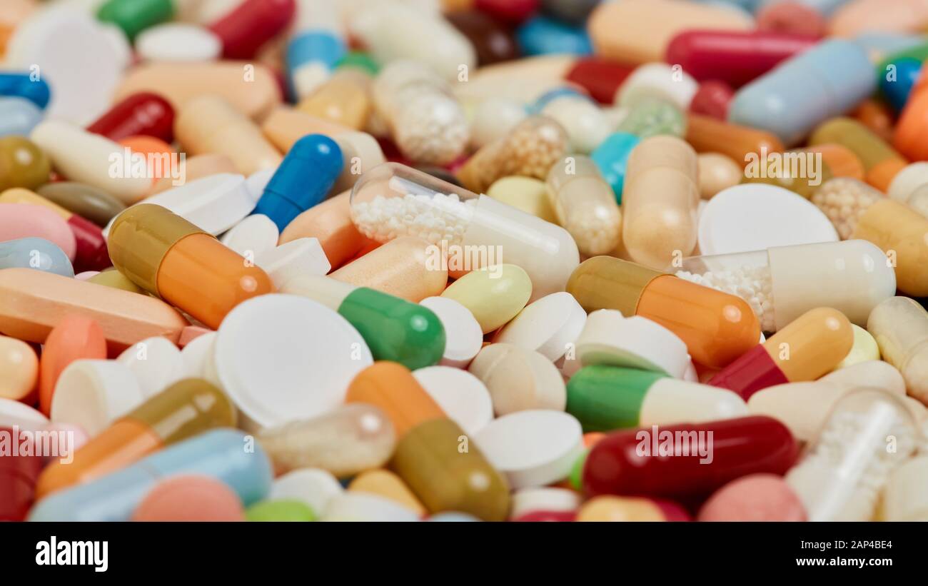 Medicine background with a lot of different colorful medicines drugs ...