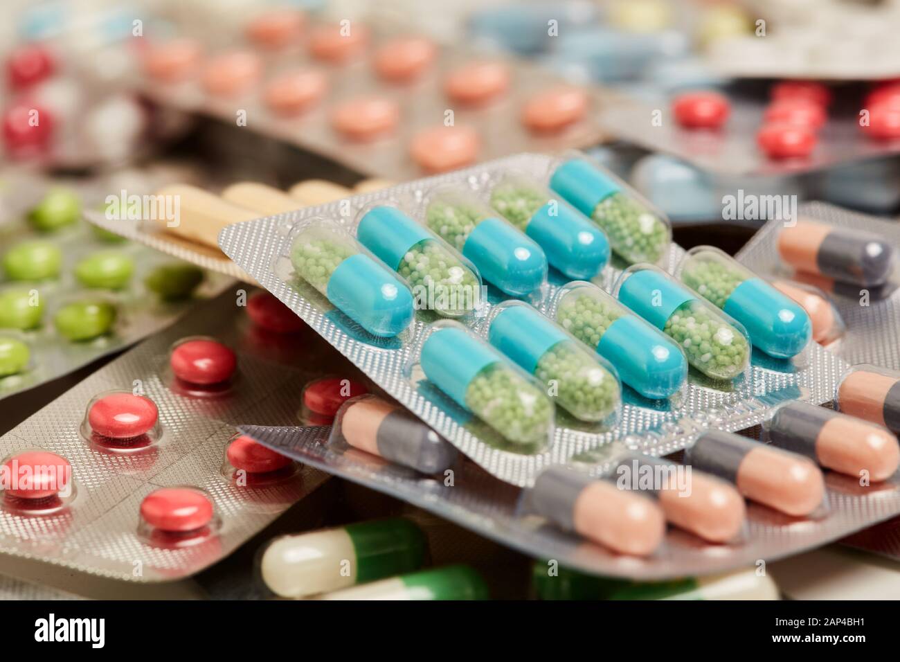 Many colorful medicines drugs in packaging as healthcare background ...