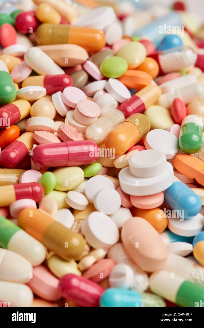 Colorful medicines drugs and tablets and capsules in a heap Stock Photo ...