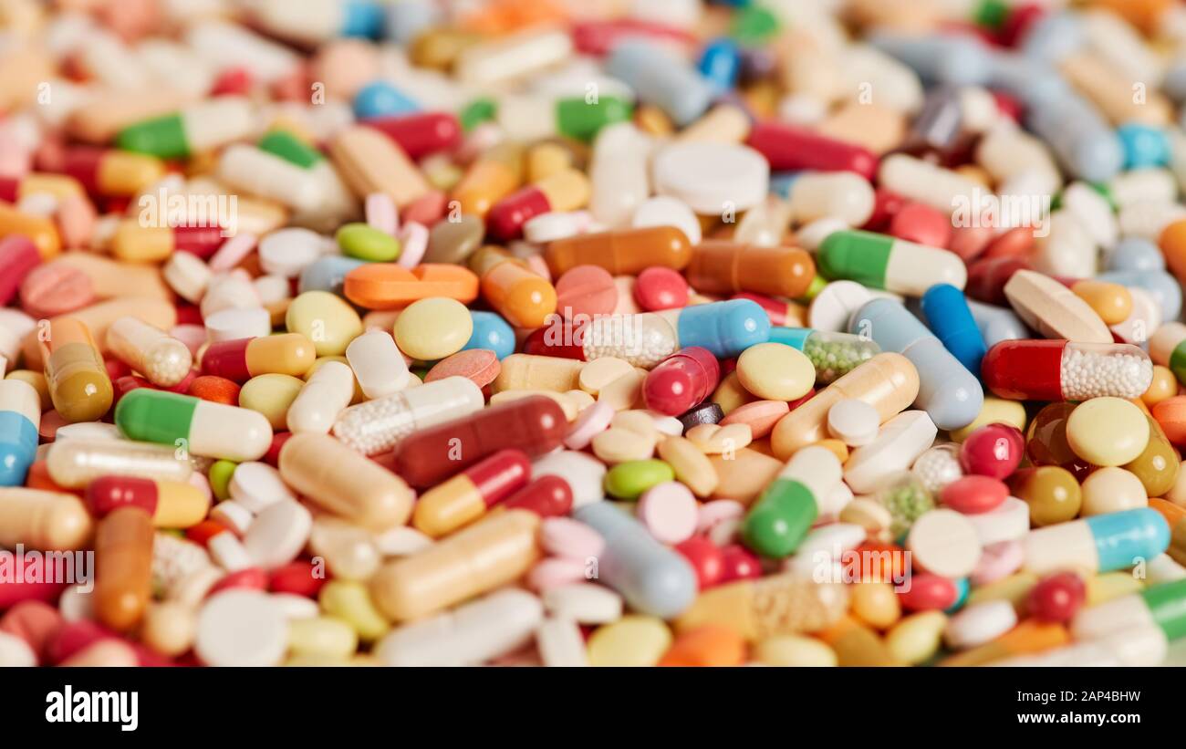 Lots of colorful medicines drugs in a heap Stock Photo - Alamy