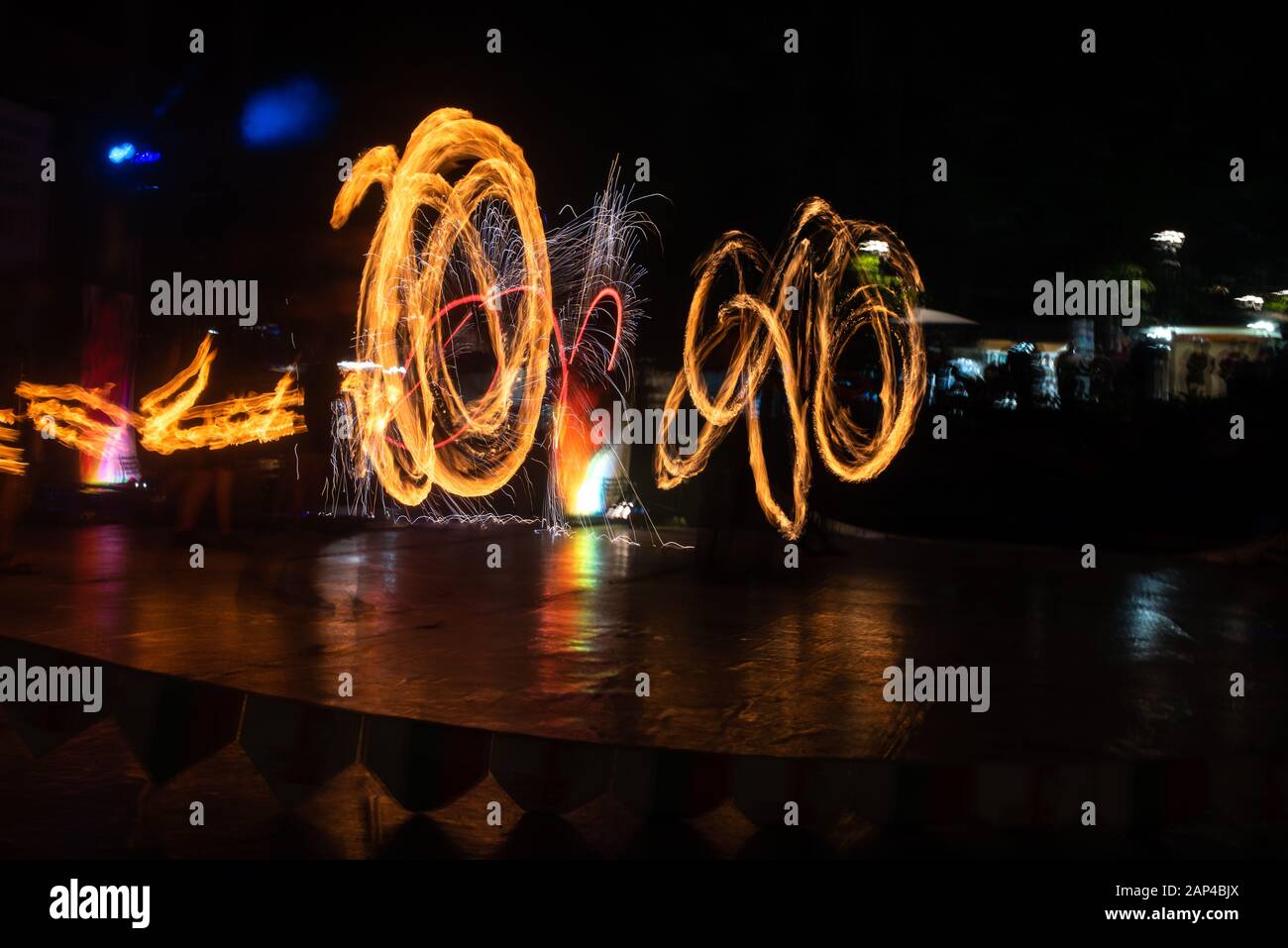 Fire Show Flaming Trails on stage slow shutter exciting event concept ...