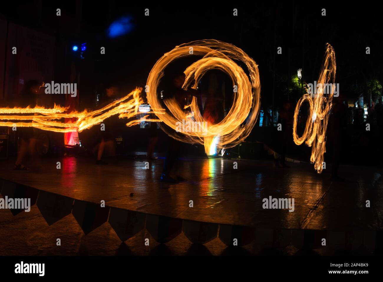 Fire Show Flaming Trails on stage slow shutter exciting event concept ...
