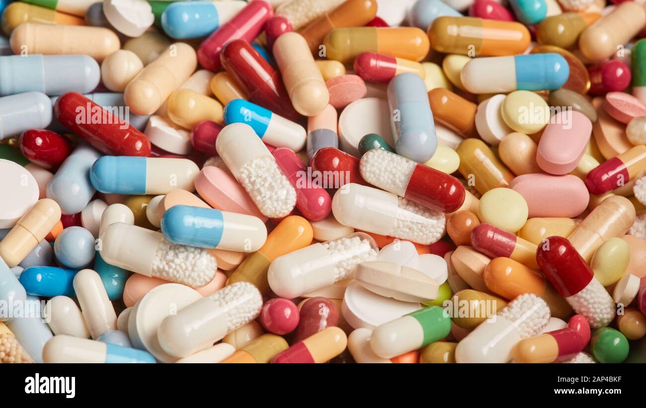 Lots of colorful medicines drugs and pills and tablets in a heap Stock ...