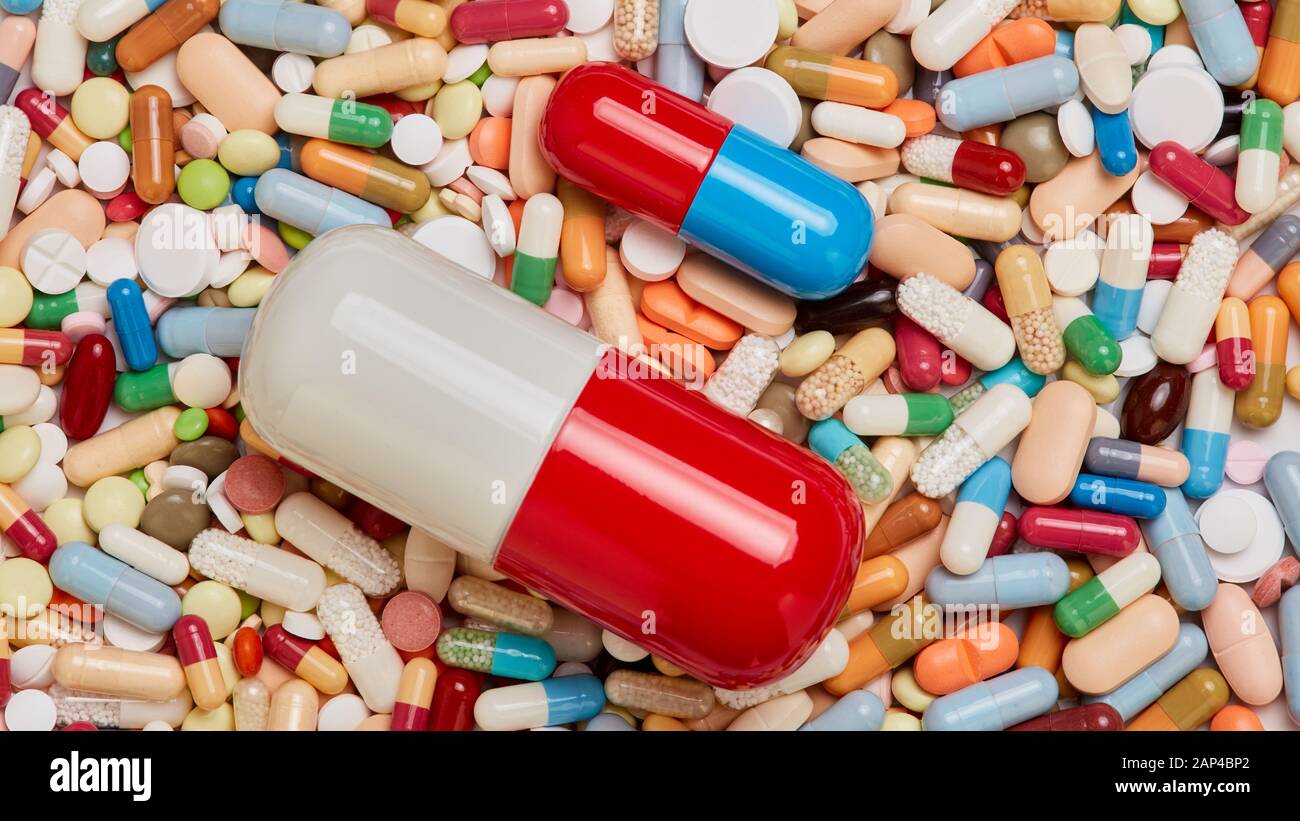 Comparison of different sized drugs and pills Stock Photo - Alamy