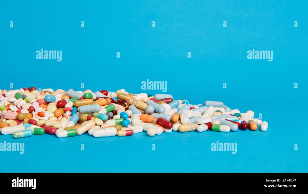 Medicine and medication concept against a blue background Stock Photo ...