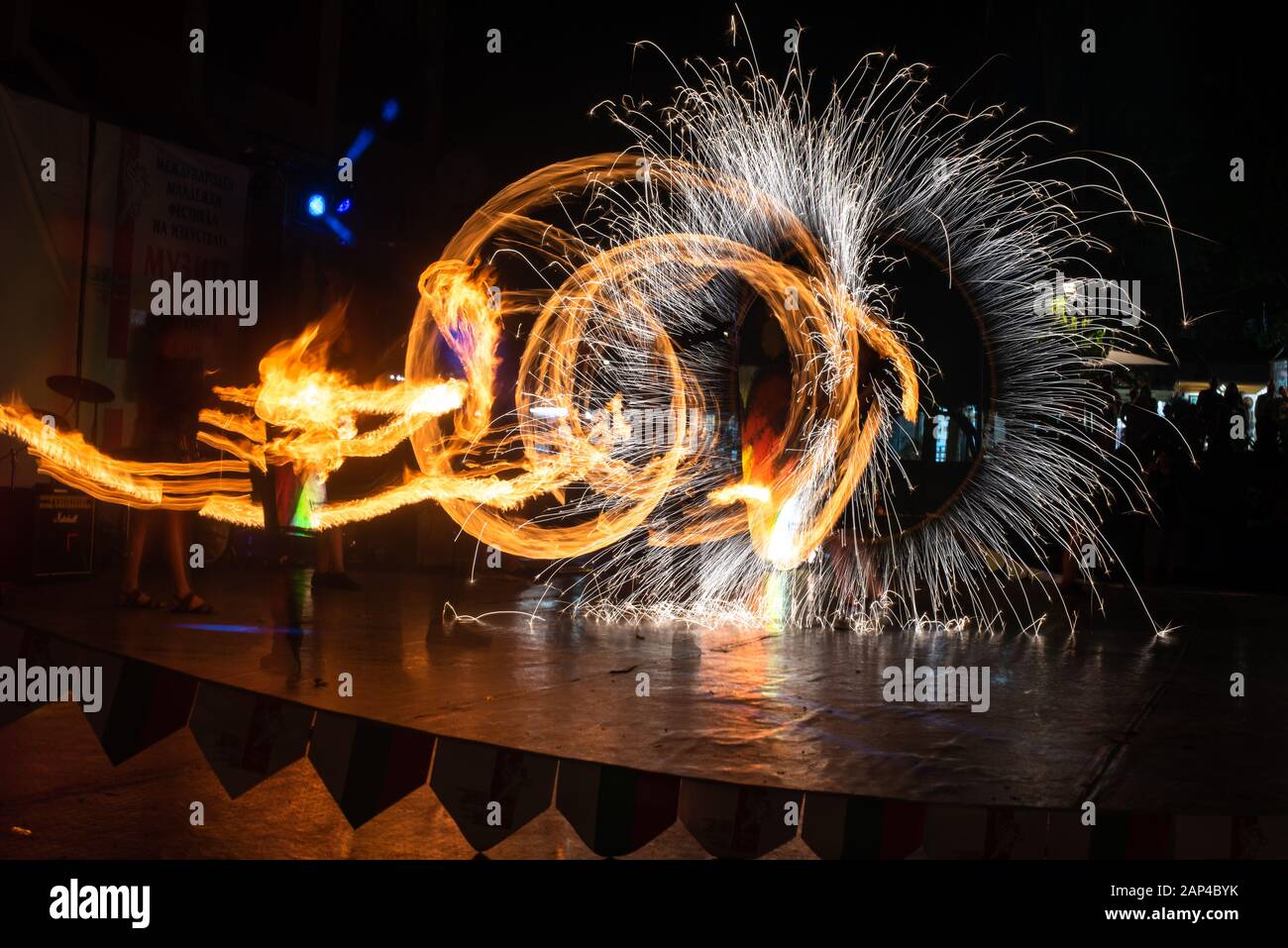 Fire Show Flaming Trails on stage slow shutter exciting event concept ...