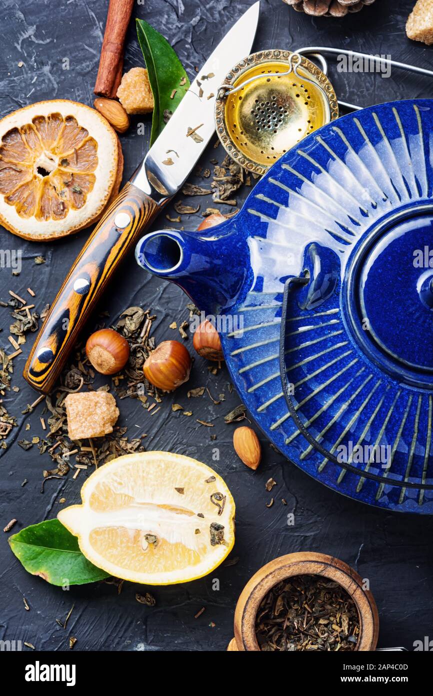 Natural ingredients for tea.Porcelain blue teakettle.Useful tea with ...