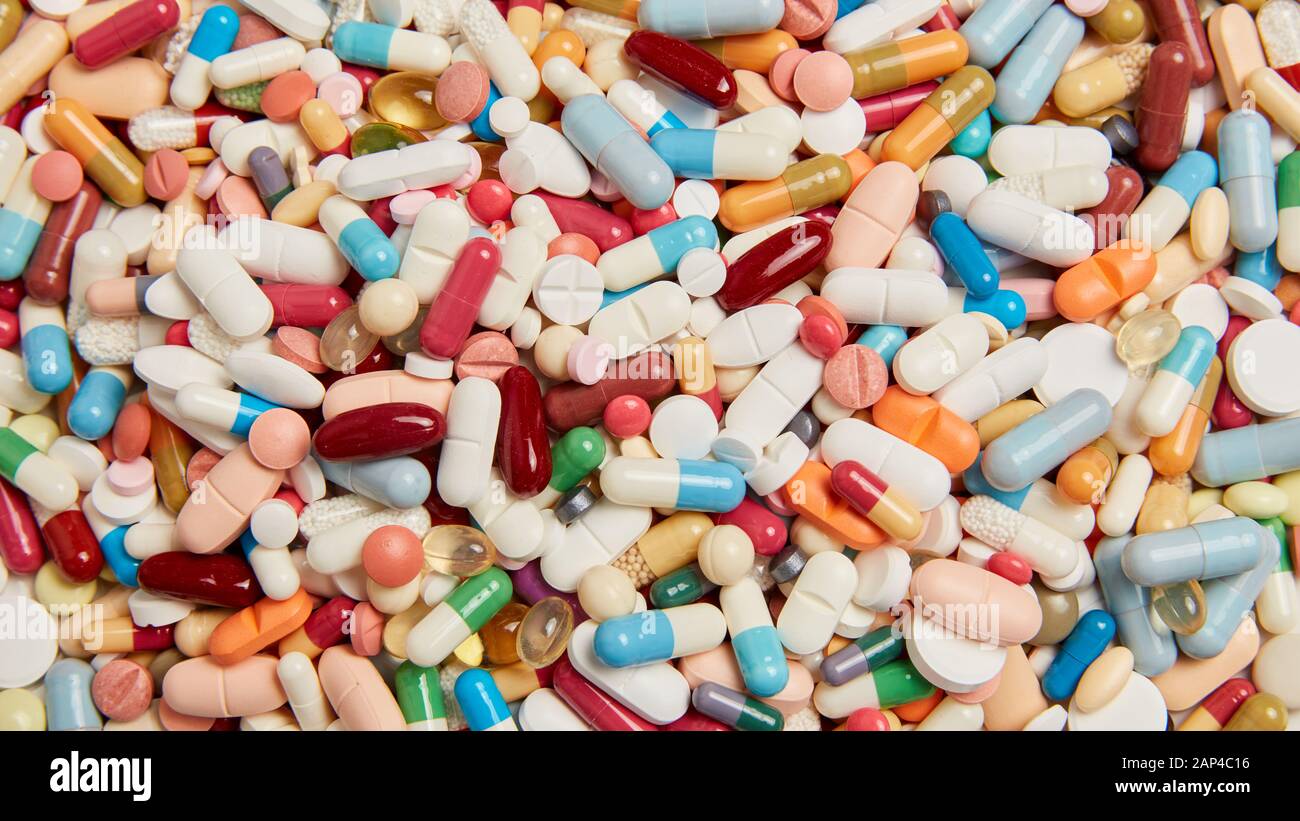 medicines drugs background with lots of colorful pills and tablets ...
