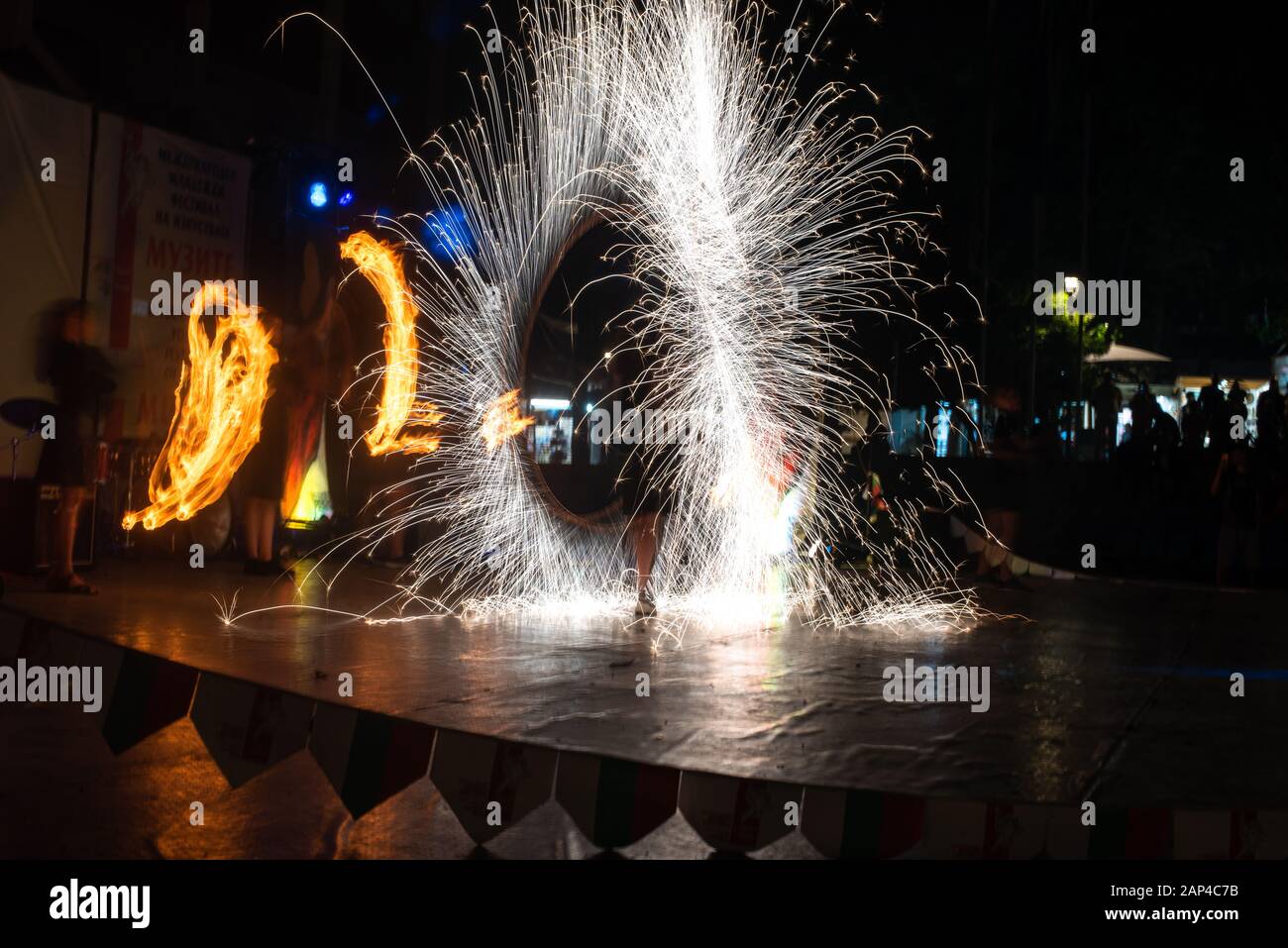 Fire Show Flaming Trails on stage slow shutter exciting event concept ...