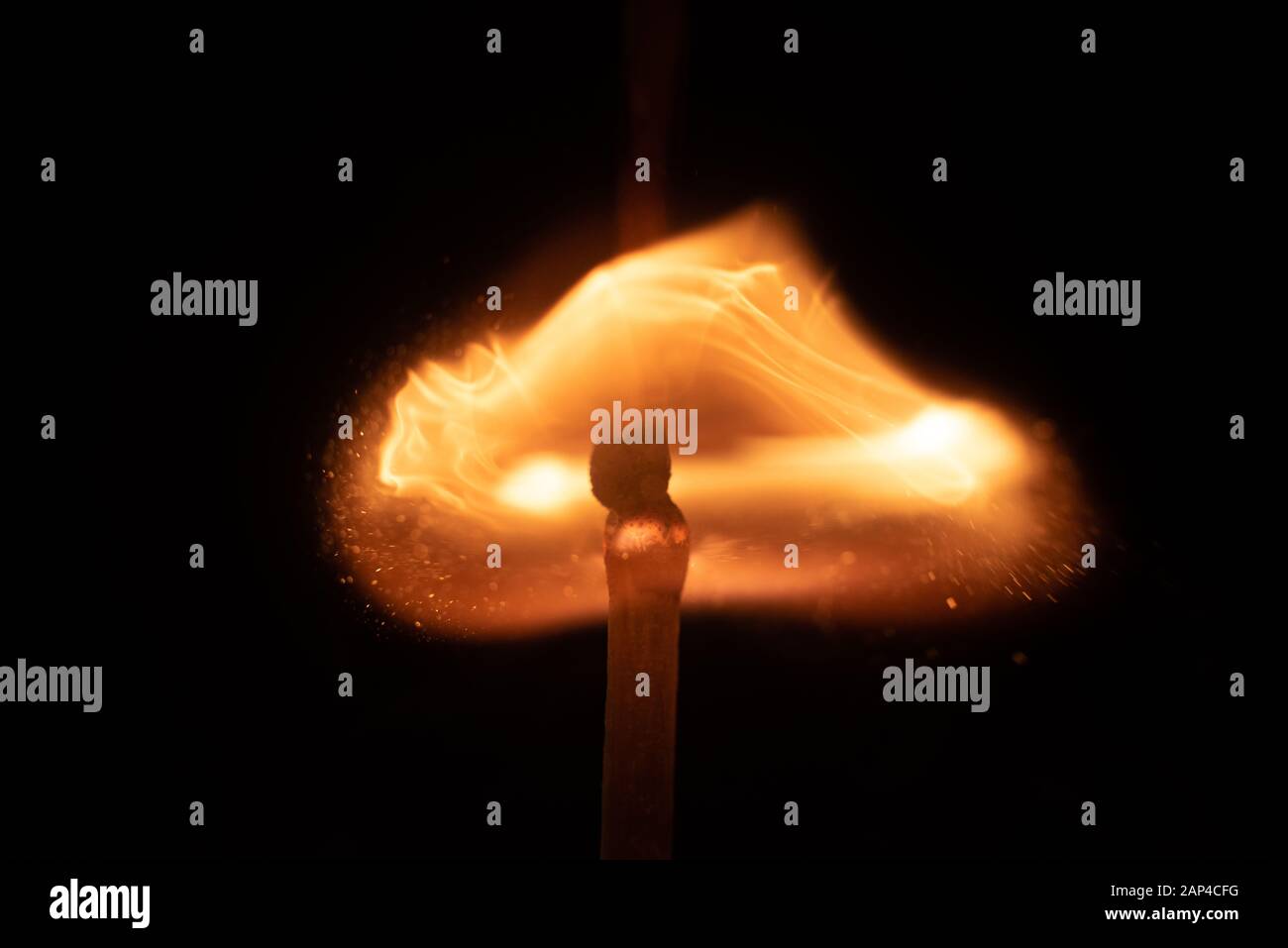 Ignition of match with sparks isolated on black background space for ...