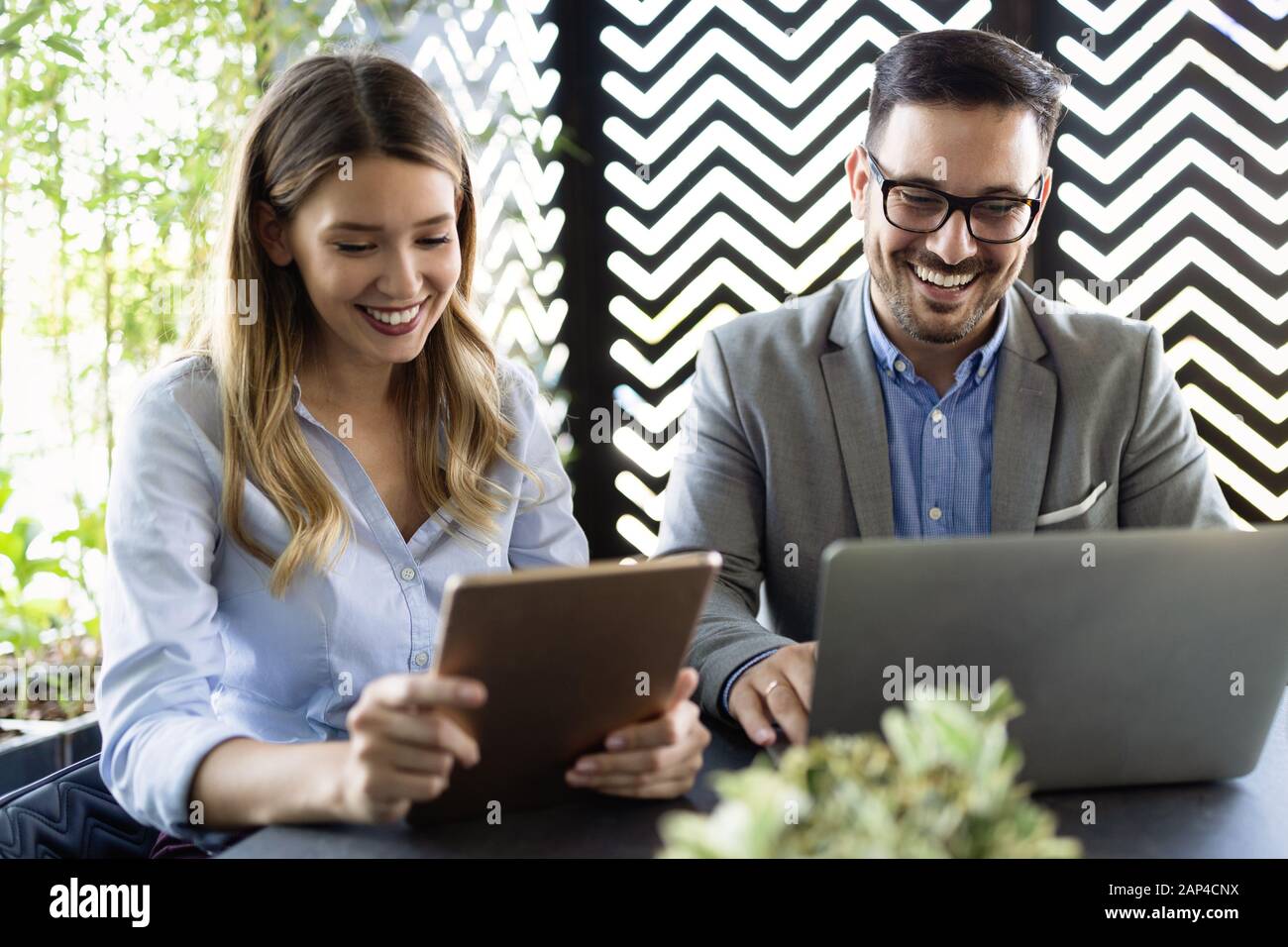 Two business colleagues at meeting in modern office interior Stock ...
