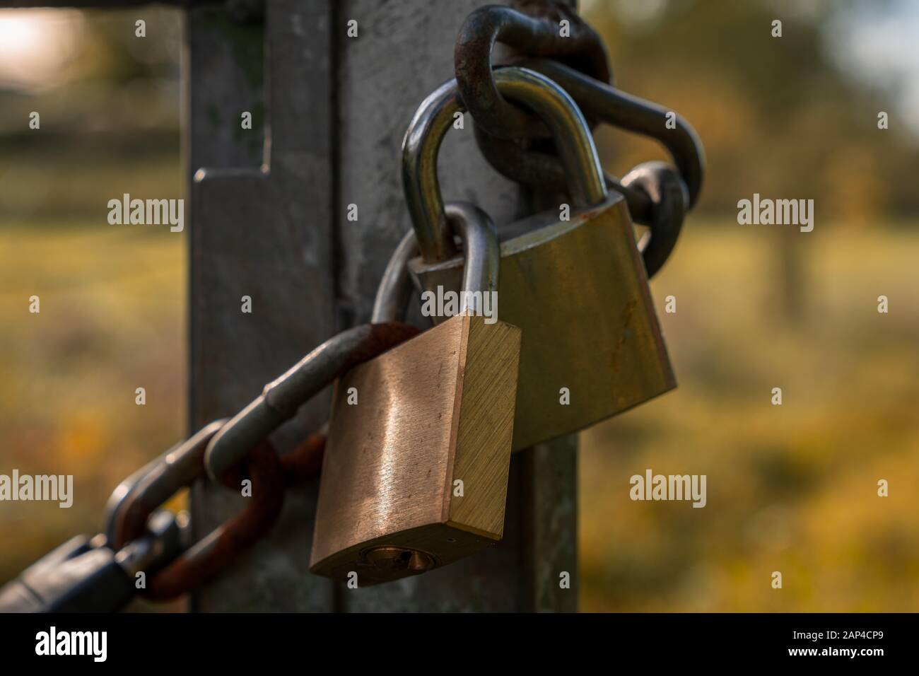 Padlocks at a gate hi-res stock photography and images - Alamy