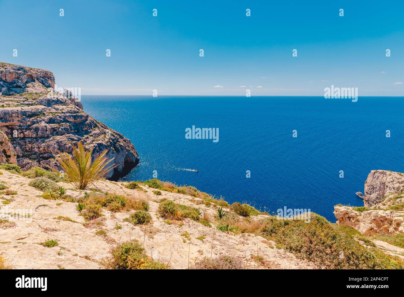 Blue Grotto in Malta. Pleasure boat with tourists runs. Natural arch ...