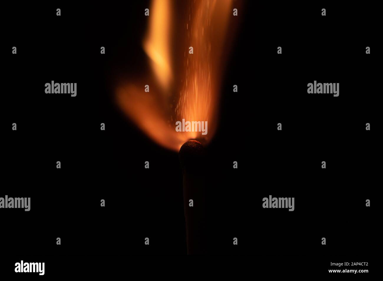 Ignition of match with sparks isolated on black background space for ...