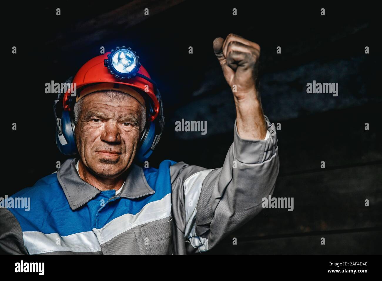 Miner man hands protest fist up revolution coal mine. Concept workers ...