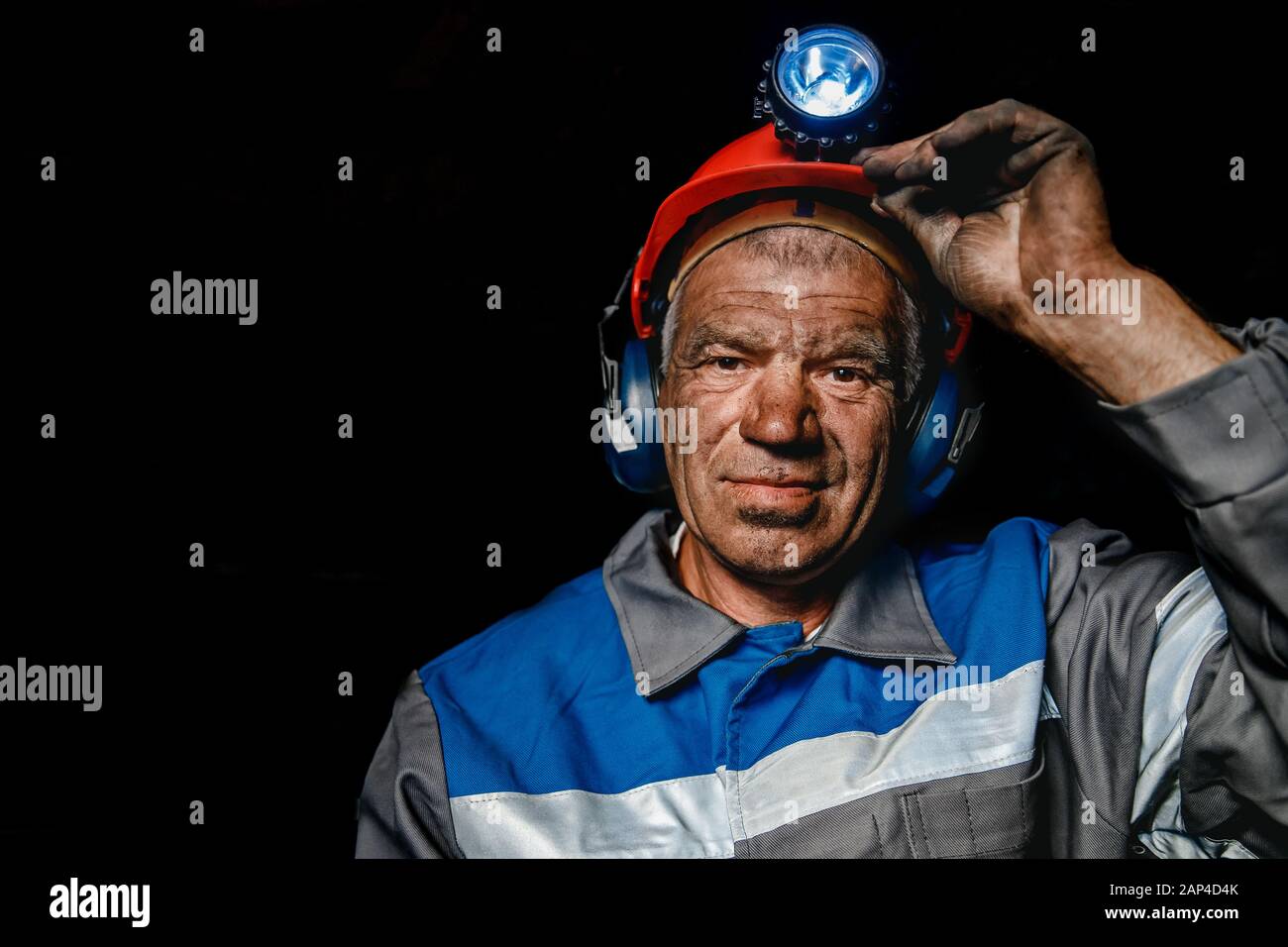Miner happy man smiling after working on coal mine. Concept industrial ...