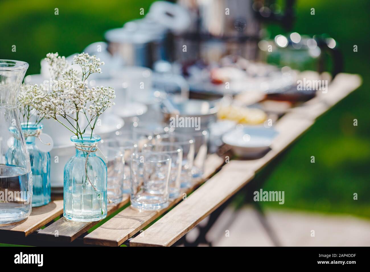 Catering service. Table setting, glass goblets, cutlery Stock Photo - Alamy