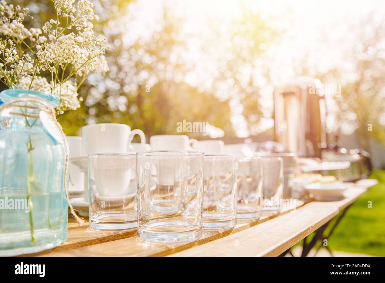 Catering service. Table setting, glass goblets, cutlery Stock Photo - Alamy