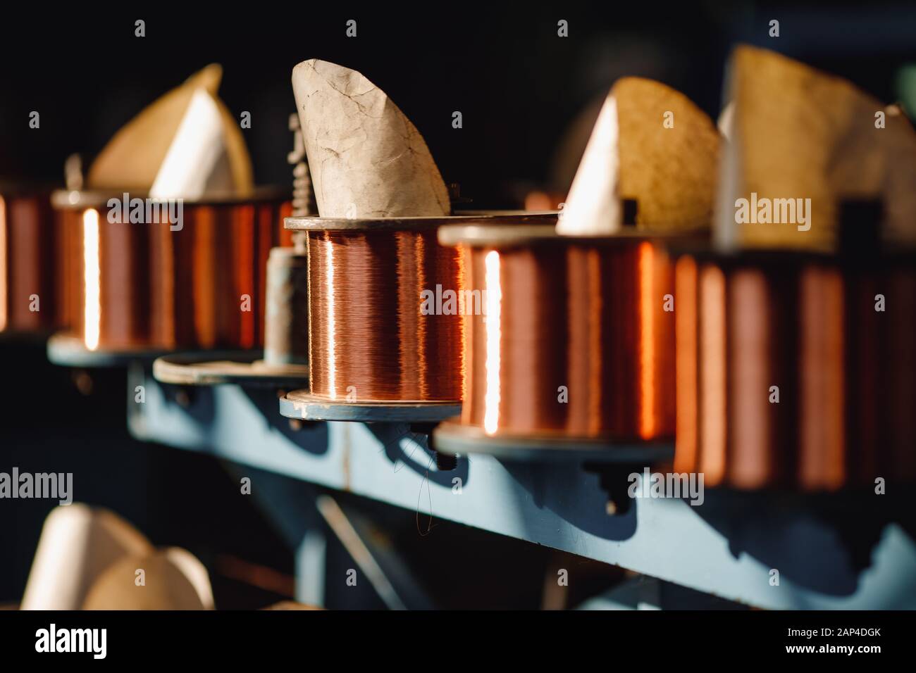 Production of copper wire, bronze cable in reels at factory Stock Photo ...