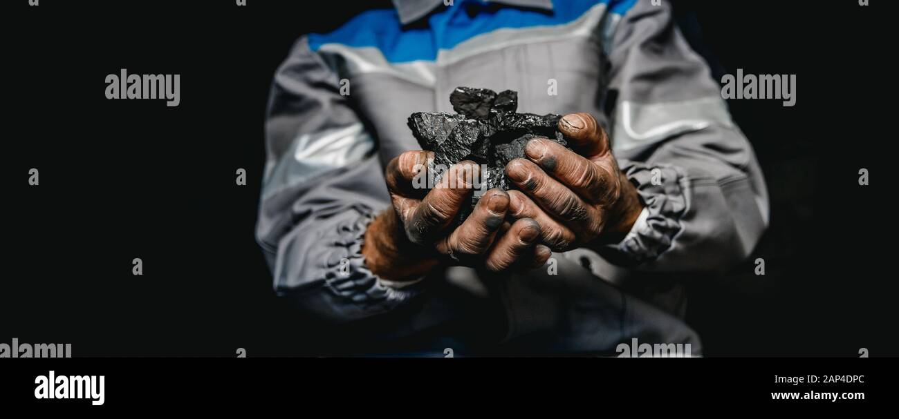 Miner dirty hands after working on coal mine. Concept industrial ...