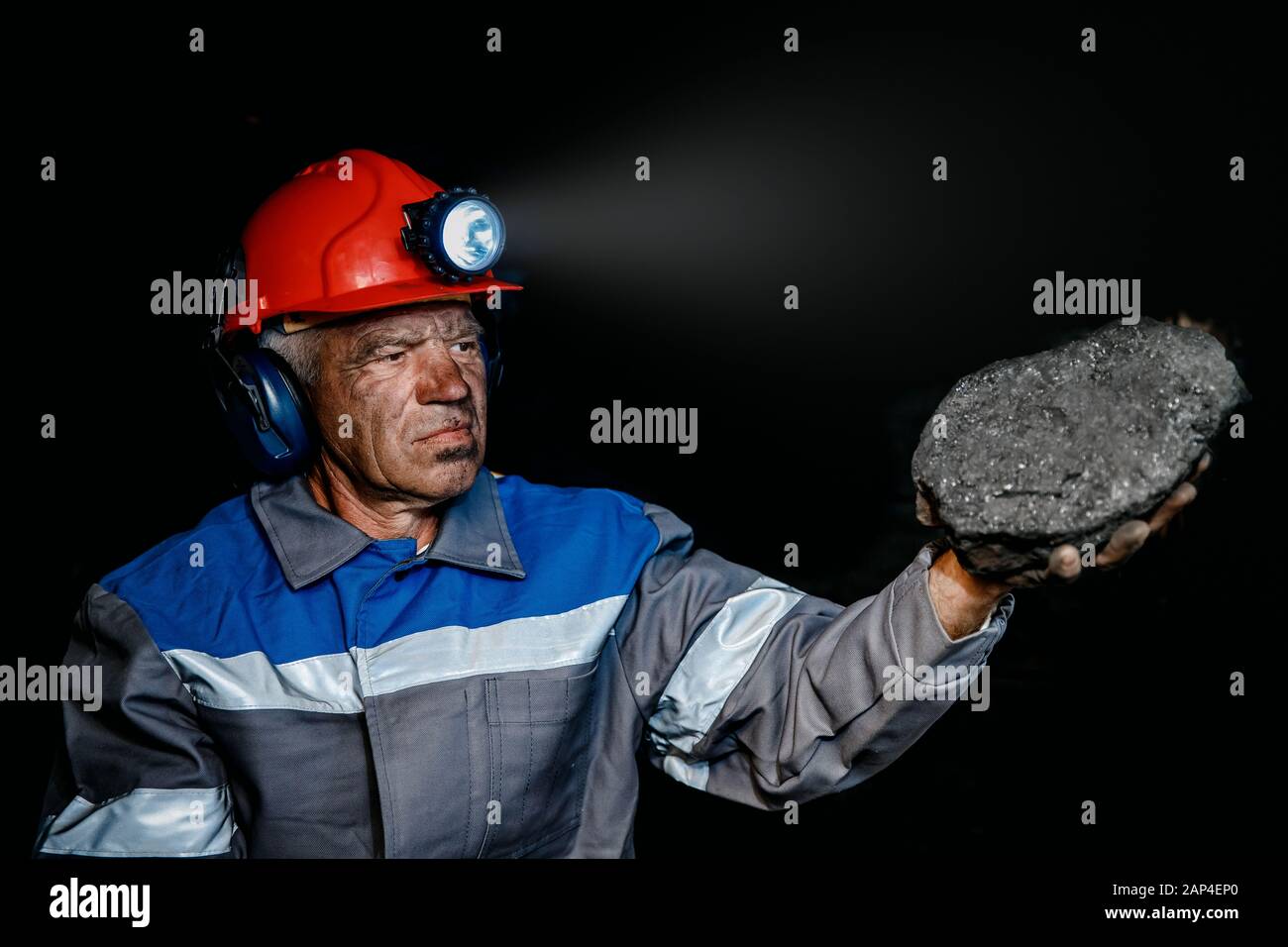 Miner after working on coal mine. Concept industrial engineer Stock ...