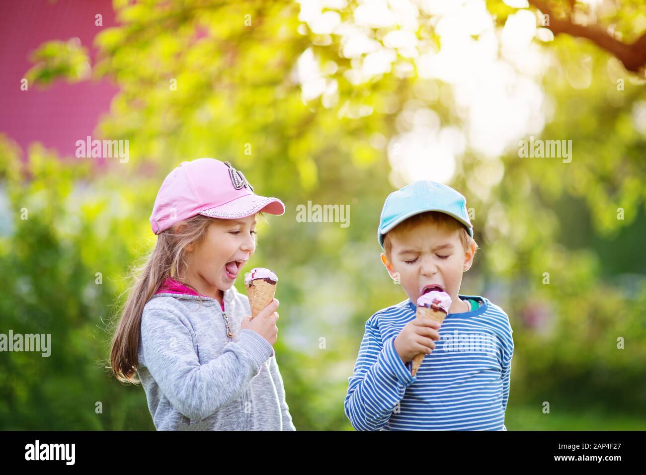 Happy child eating ice cream outdoors in summer Stock Photo - Alamy