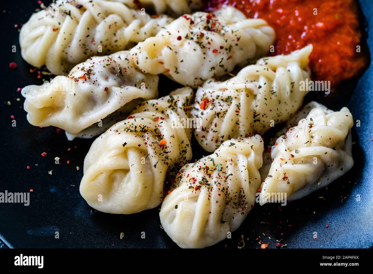 Georgian Dumplings Khinkali with Meat, Tomato Sauce and Spices / Hingel ...