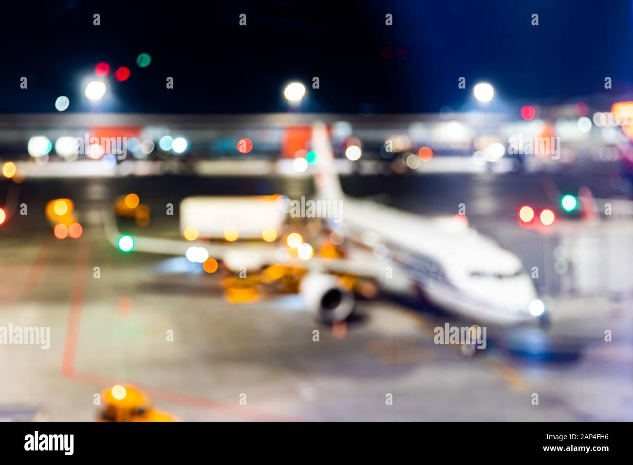 Blur of airplane airport background night against lights, waiting for ...