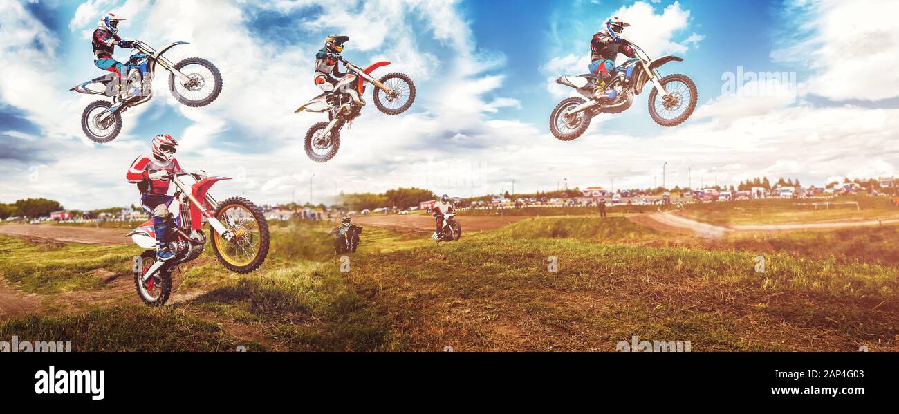 Banner rider on mountain dirtbike enduro participates in motocross ...