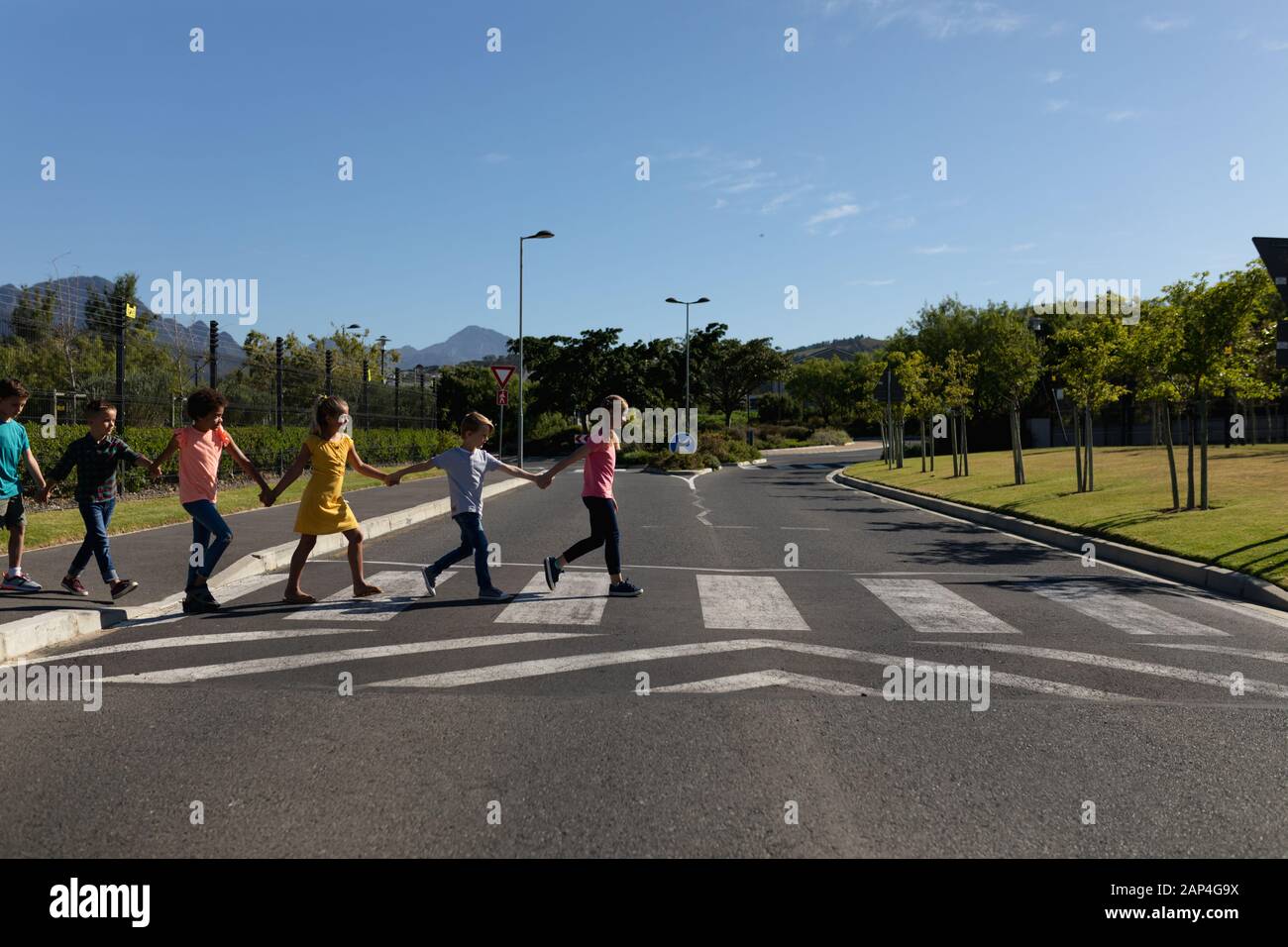 School girl crossing road hi-res stock photography and images - Alamy