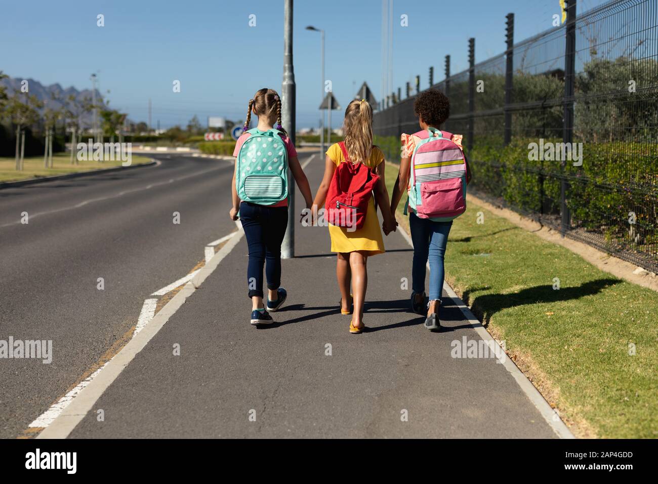 Schoolgirls walking hi-res stock photography and images - Alamy