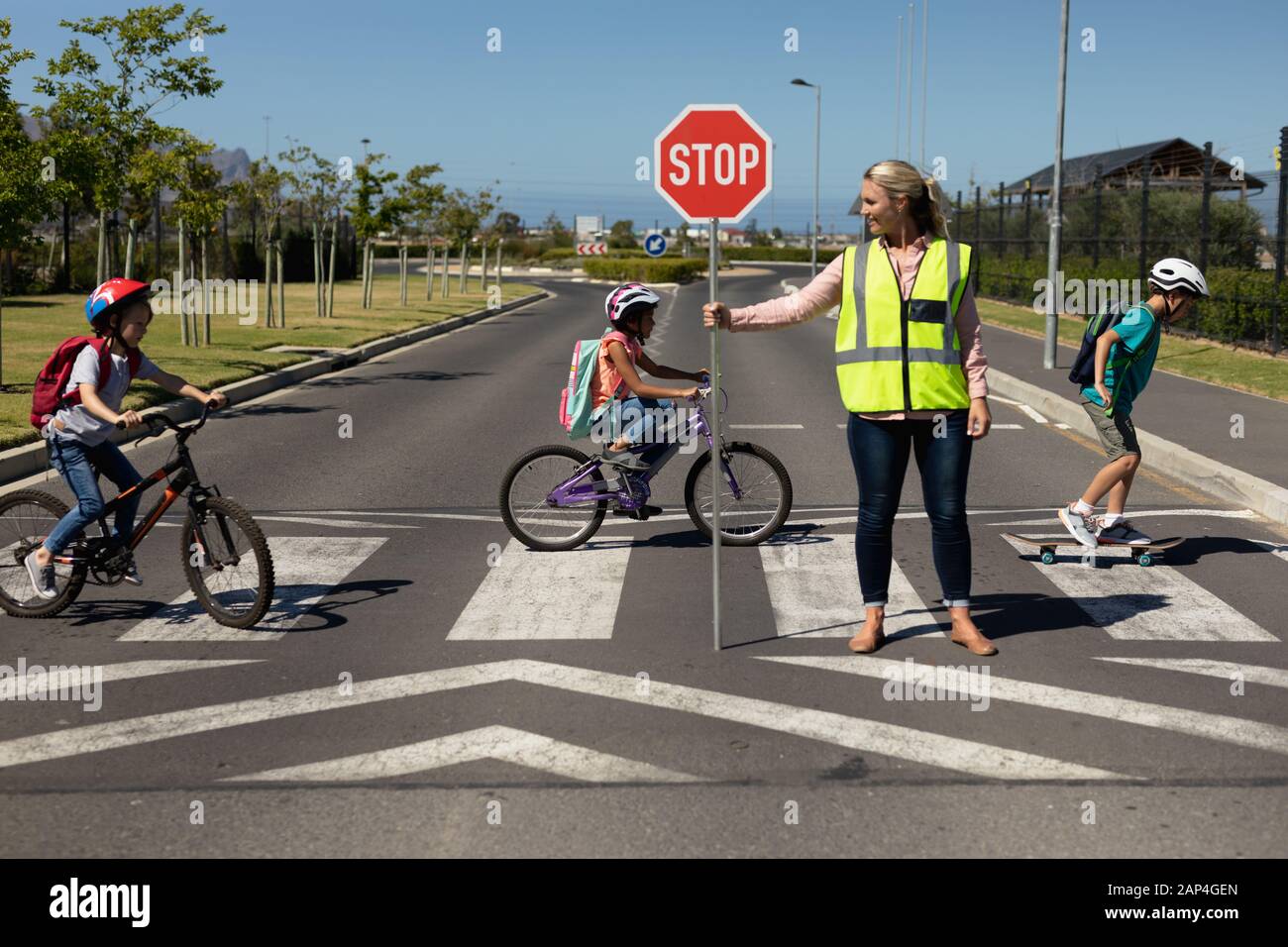 Boy riding bike stop sign hi-res stock photography and images - Alamy