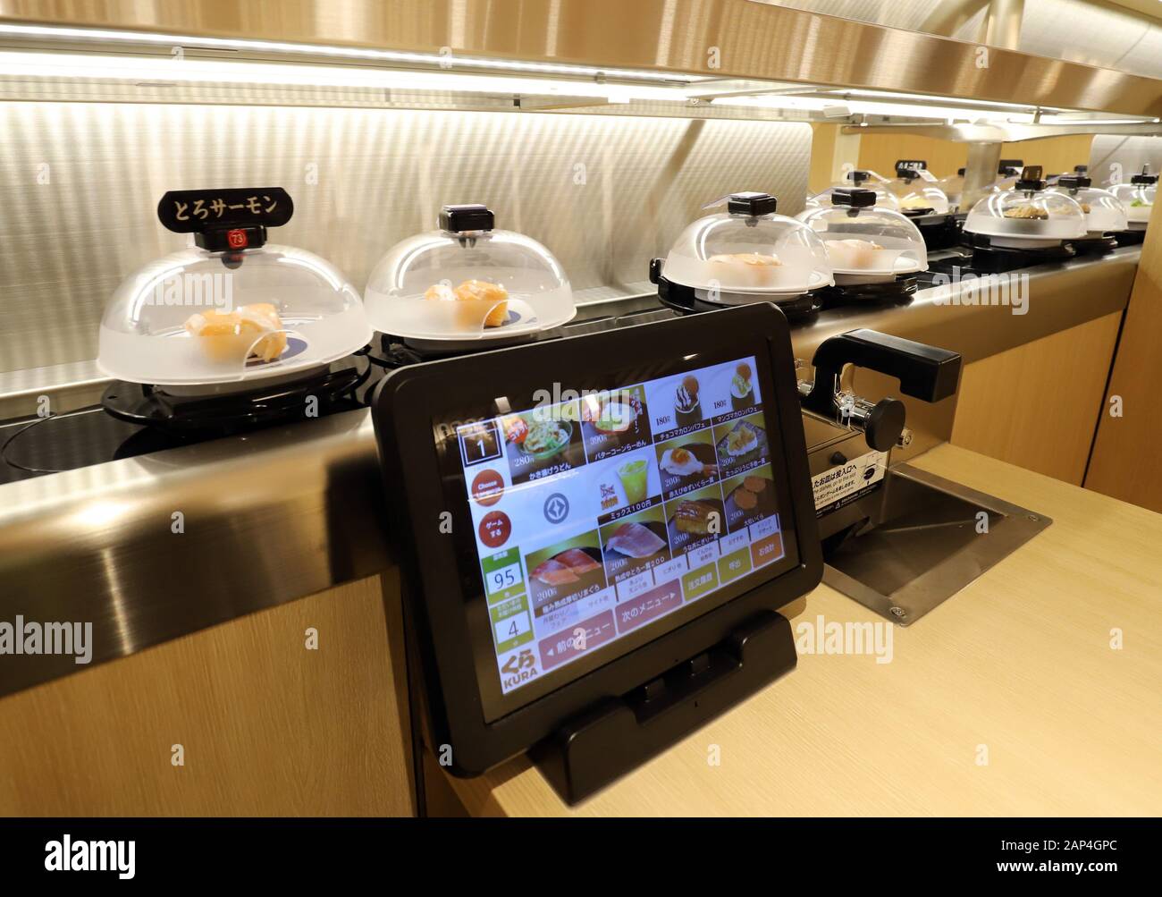 Tokyo, Japan. 21st Jan, 2020. Sushi dishes move on a conveyor belt at ...