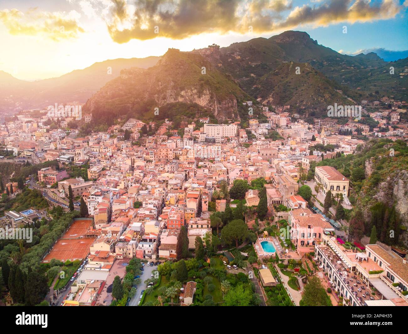 Taormina, Sicily Italy sunset, volcano Etna in clouds. Aerial top view ...