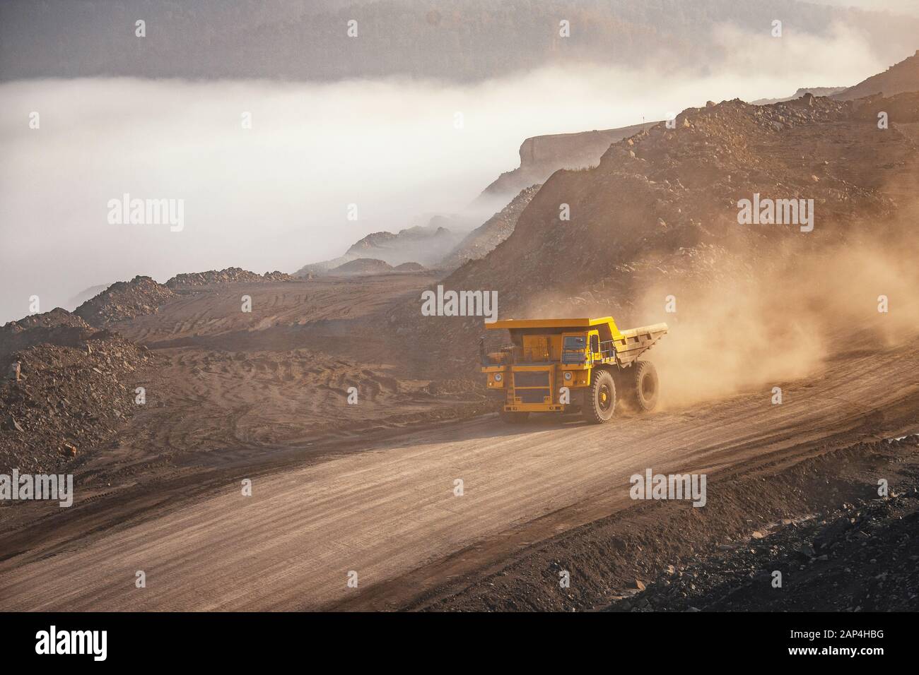 Open gold pit mine industry. Big yellow mining truck for gold moving on ...