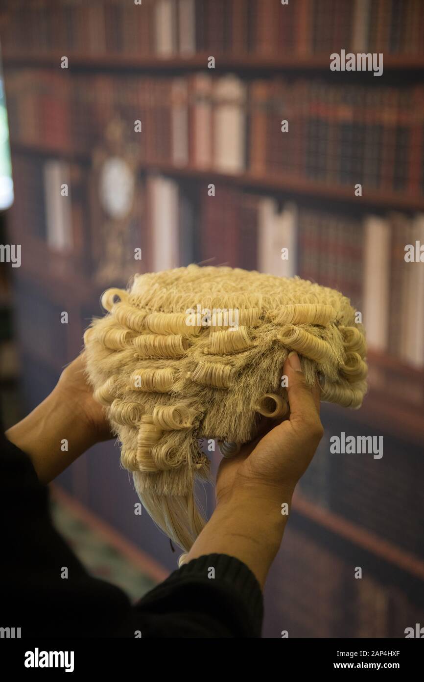 A wig being held, as worn by some judges and barristers in England and ...