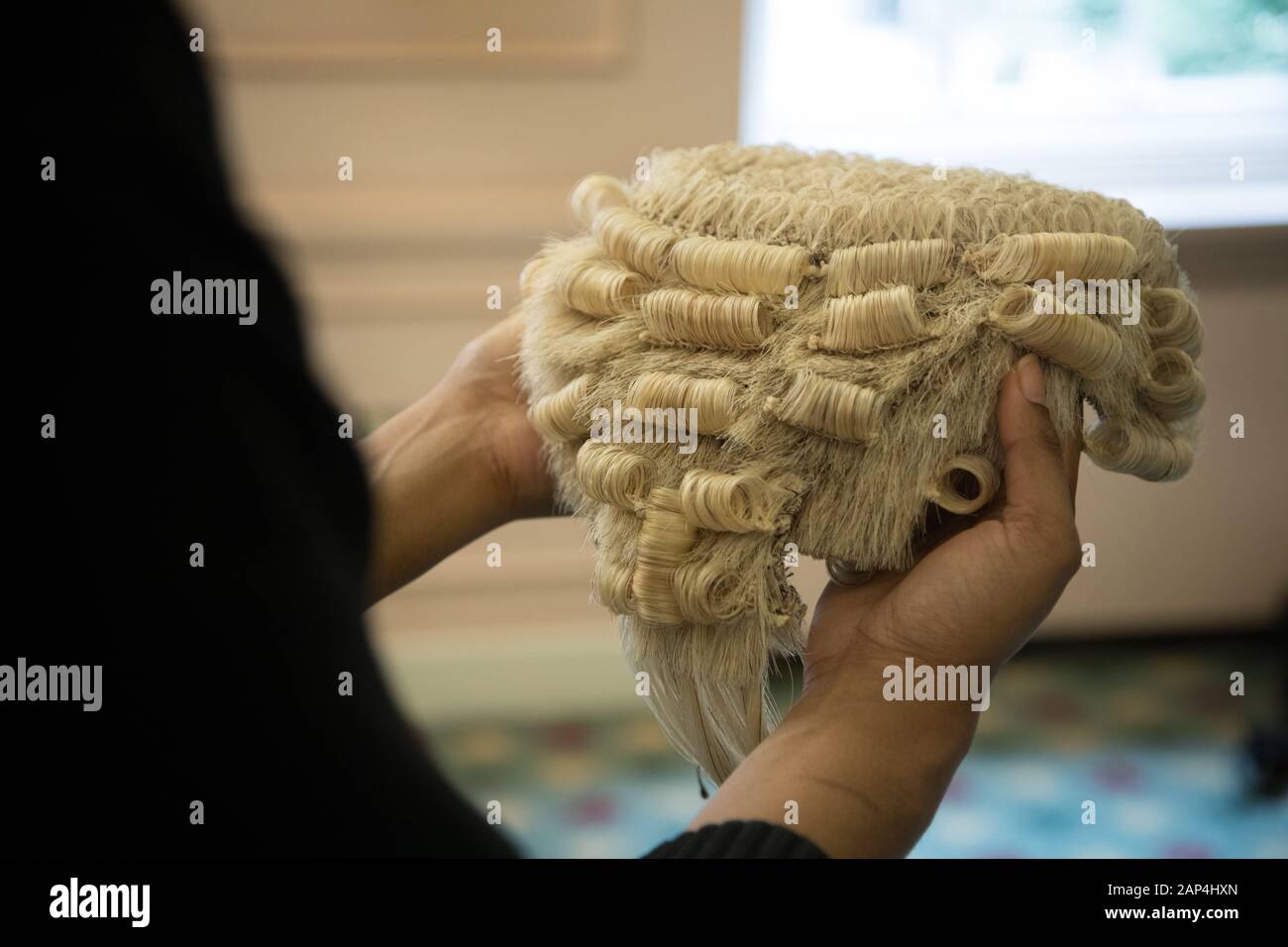 A wig being held, as worn by some judges and barristers in England and ...