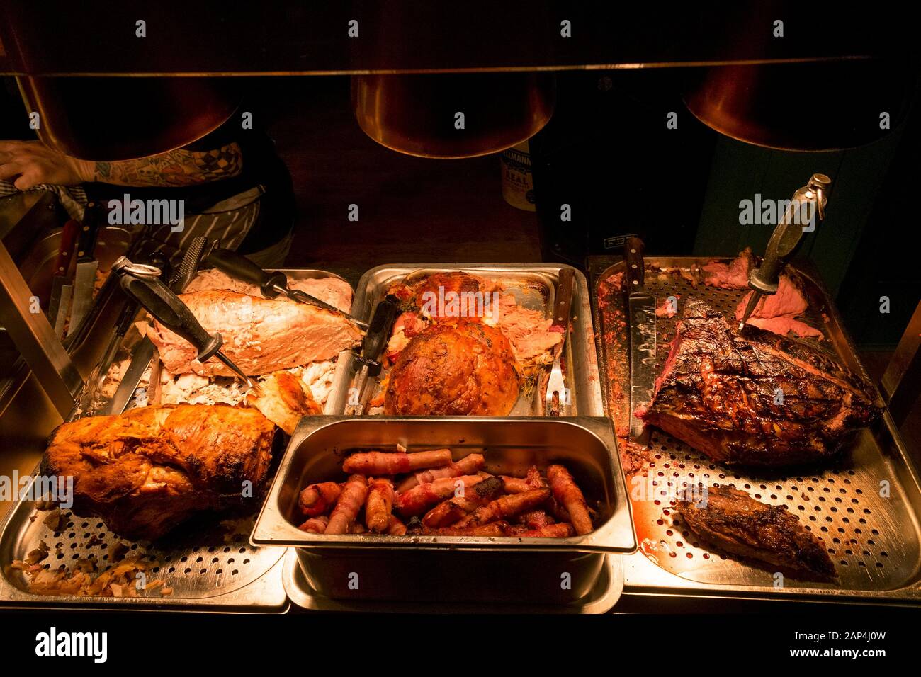 Various cooked meats available at a Sunday lunch carvery in a ...