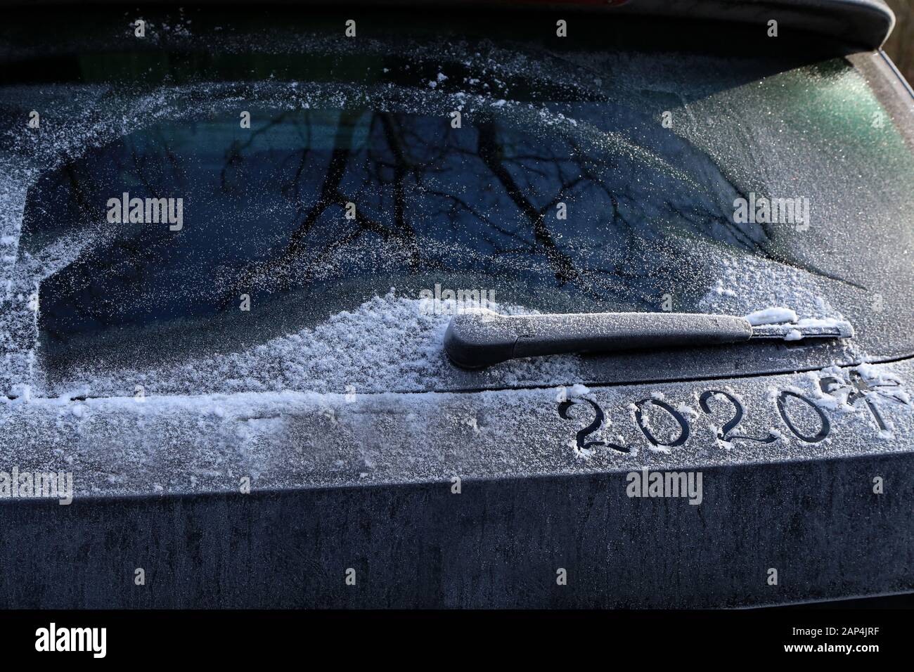 drawing on the frozen car windows on a frosty morning Stock Photo - Alamy