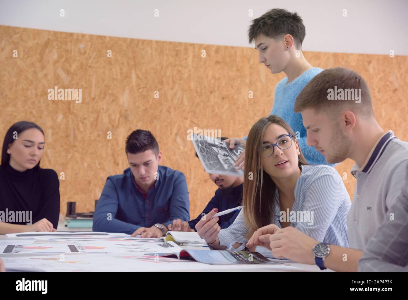 Group of university architecture students working on practice lessons ...